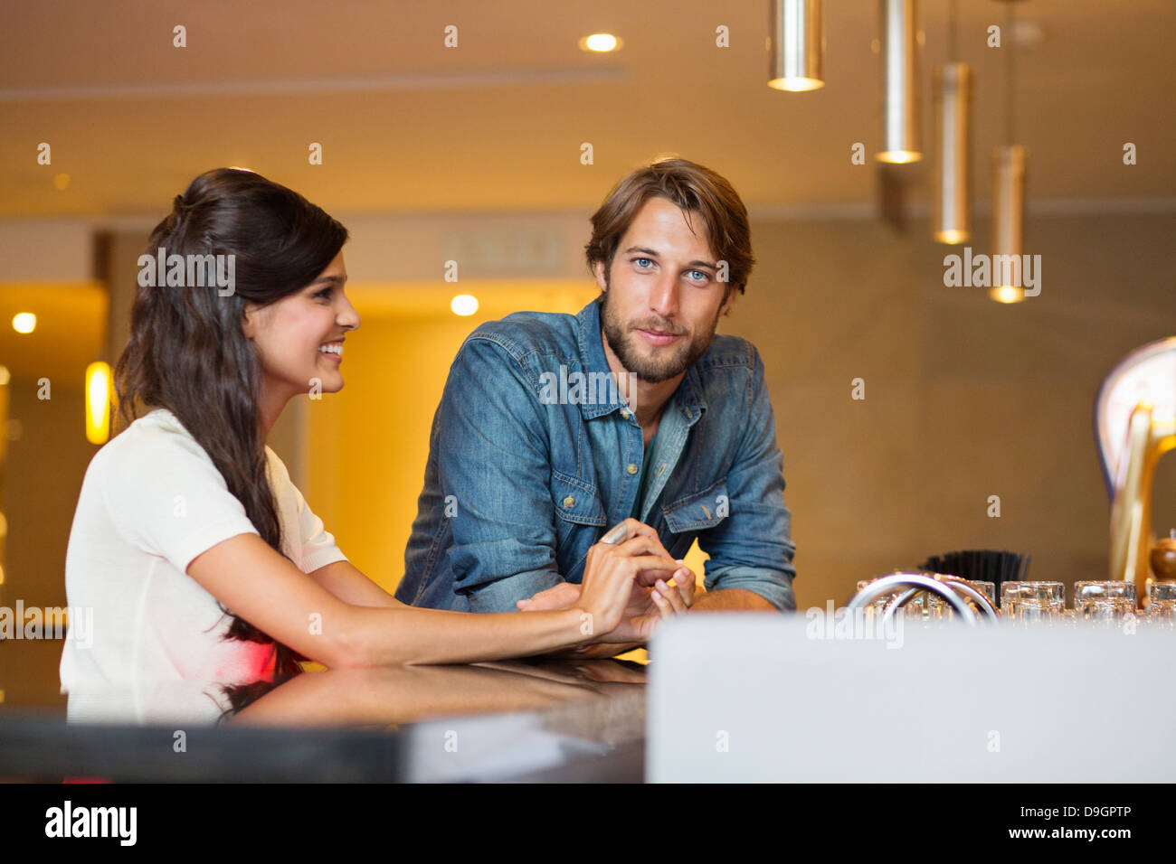 Couple at a bar counter Stock Photo - Alamy
