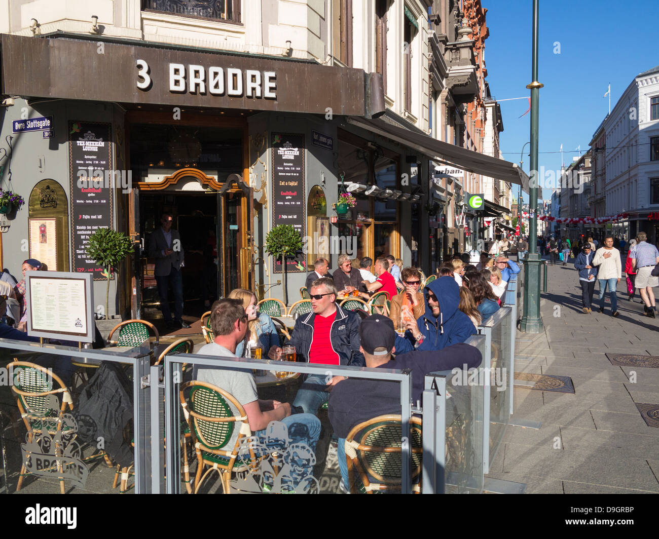 Oslo bar cafe in the city centre with people sitting outside at tables ...