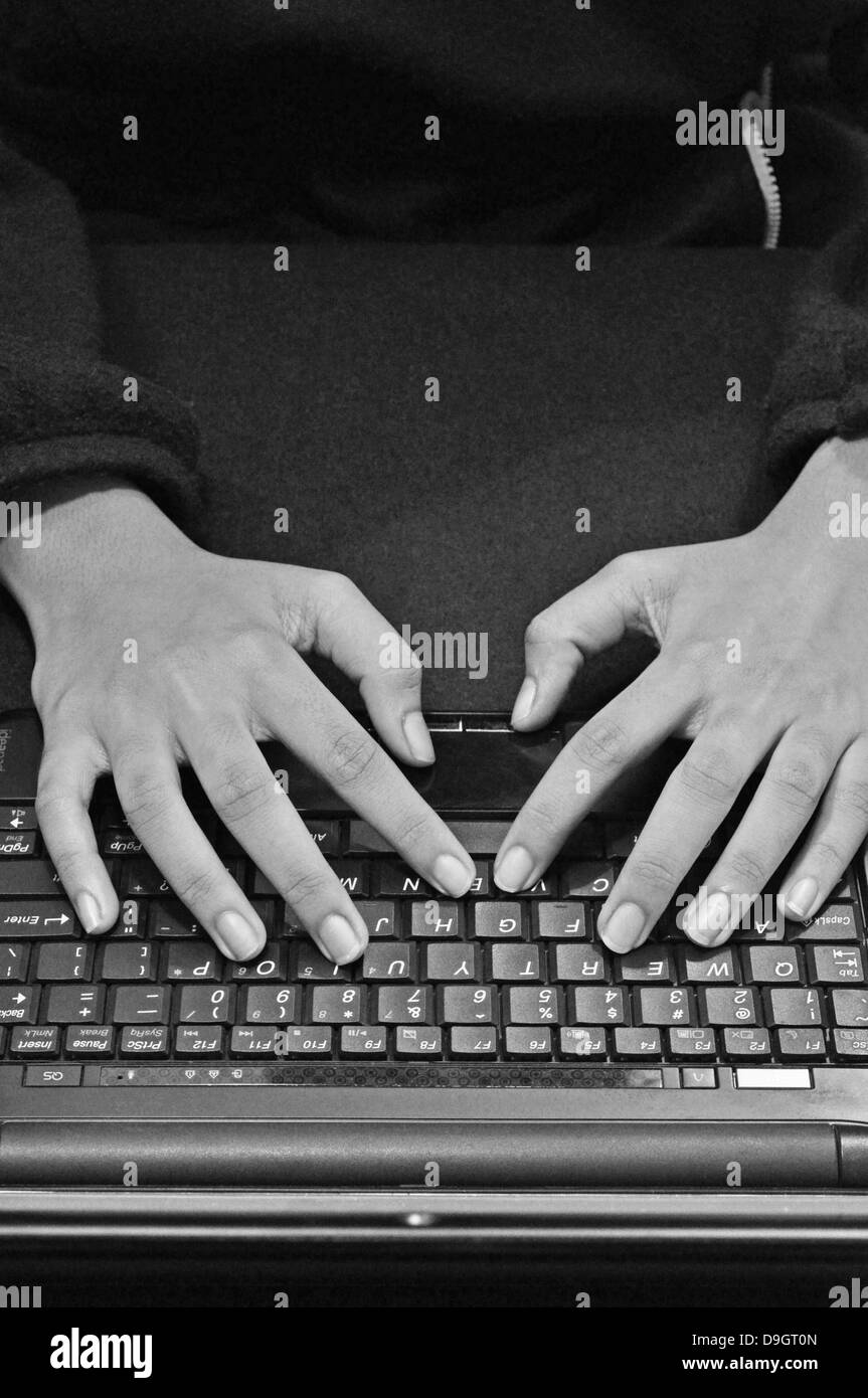 Hands typing on laptop computer Black and White Stock Photos & Images ...