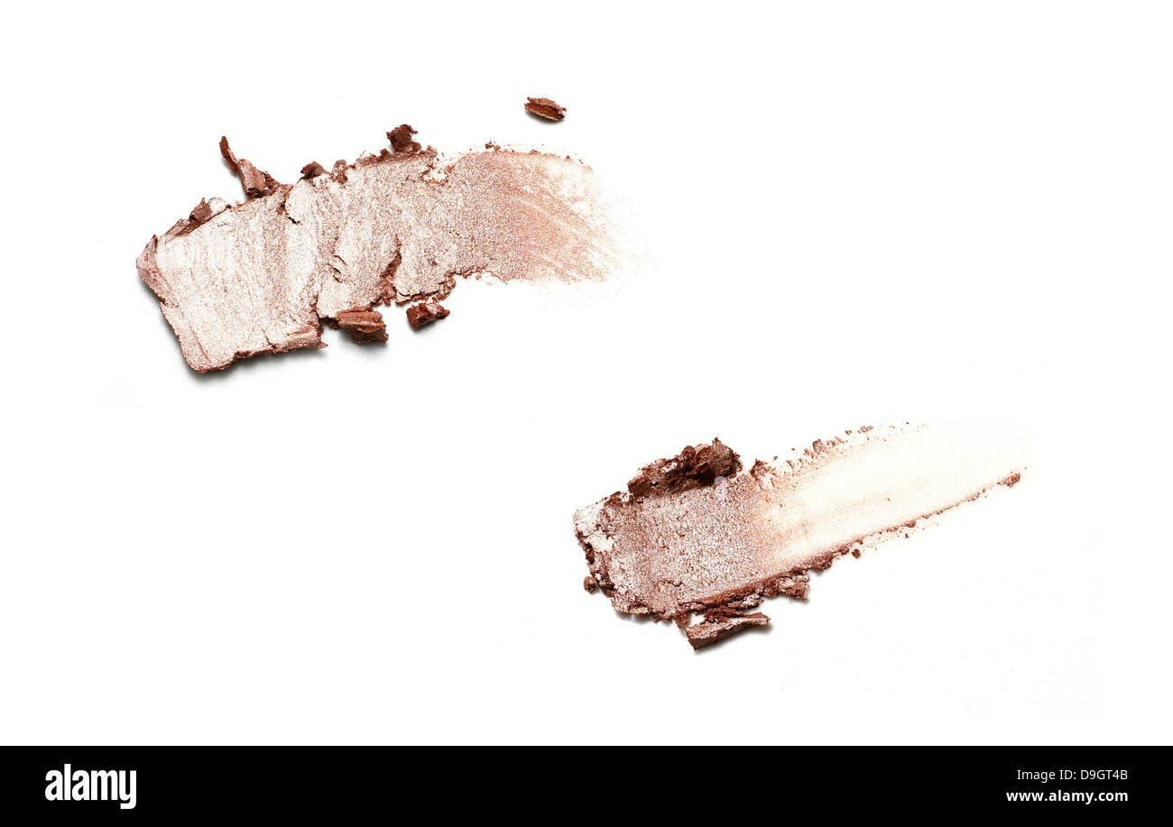 pinky gold shimmer eyeshadow smear cut out onto a white background ...