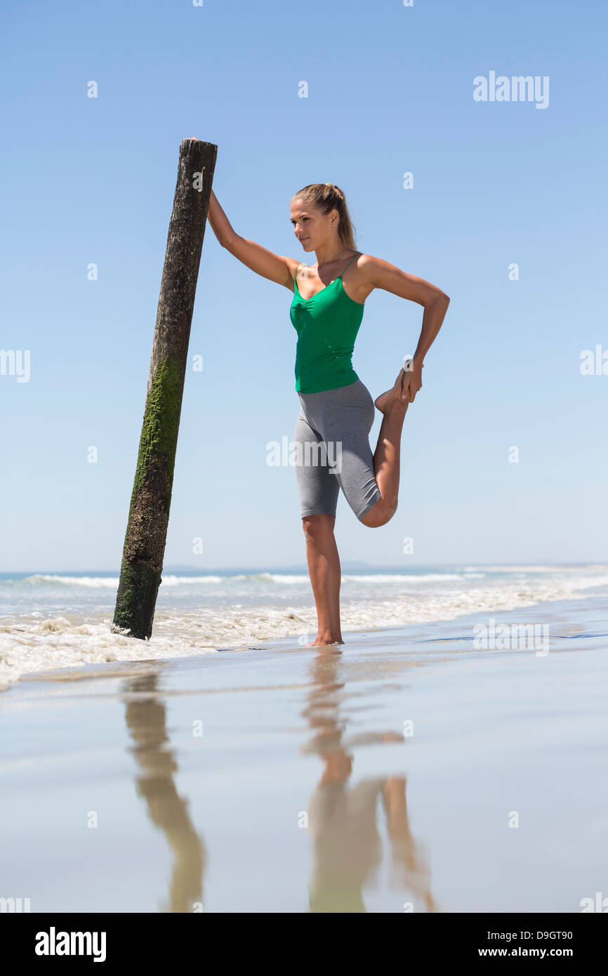 Woman holding pole on beach hi-res stock photography and images - Alamy