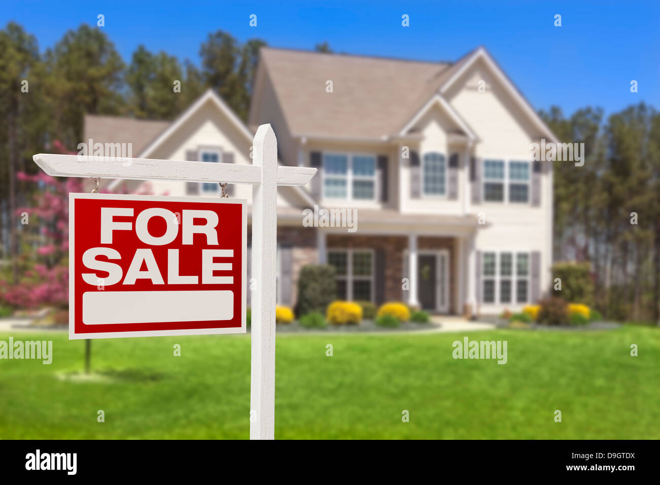 Home For Sale Real Estate Sign and Beautiful New House Stock Photo - Alamy