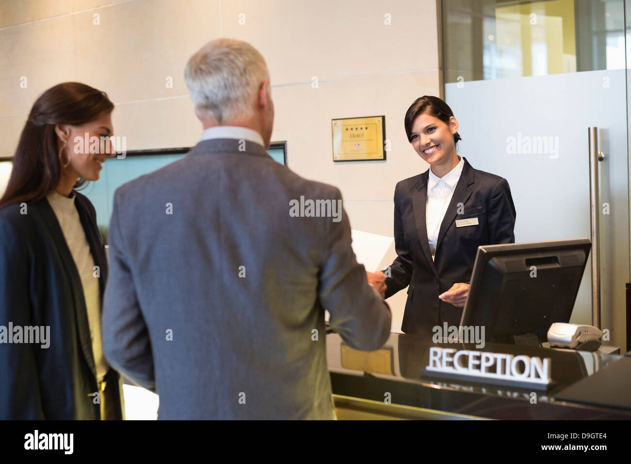 Couple luxury hotel check in hi-res stock photography and images - Alamy
