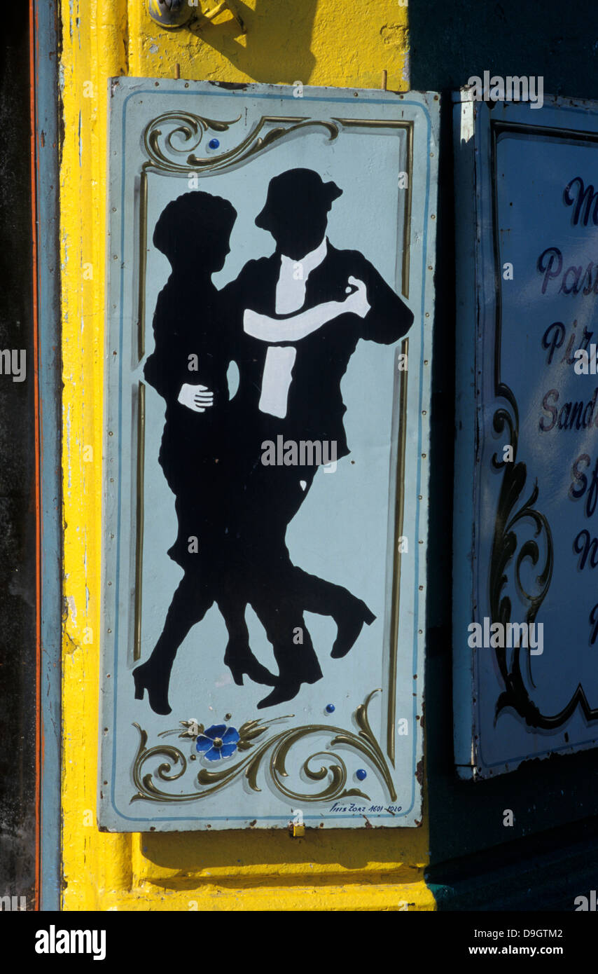 A sign with two figures dancing tango dominates the entrance of one of ...