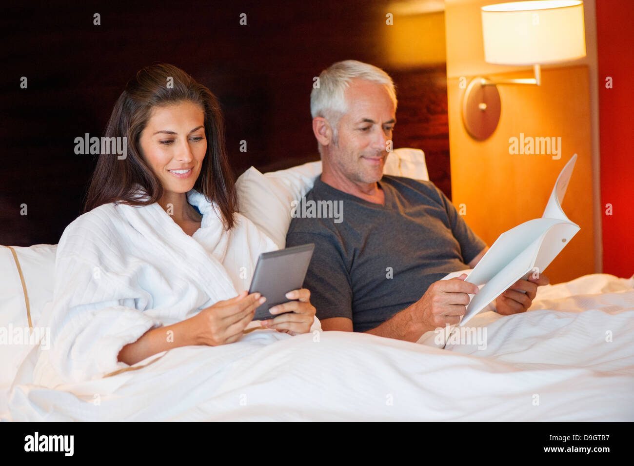 Woman using tablet in bed hi-res stock photography and images - Alamy