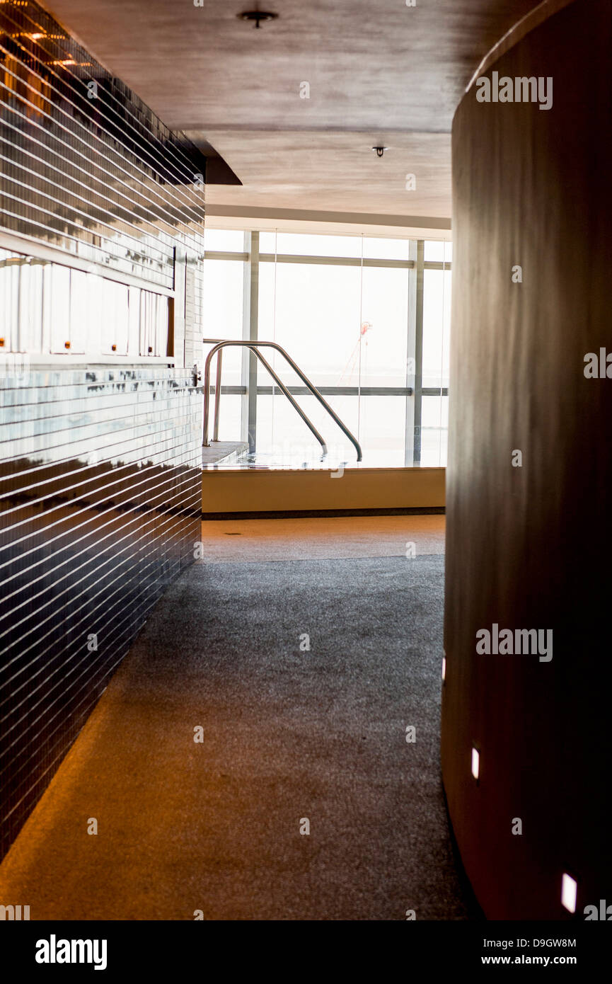 Corridor leading towards a swimming pool Stock Photo - Alamy