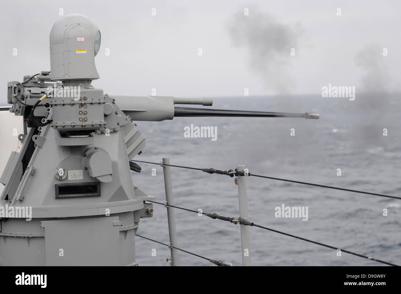 Philippine Sea, February 4, 2013 - A 25mm machine gun is fired during a ...