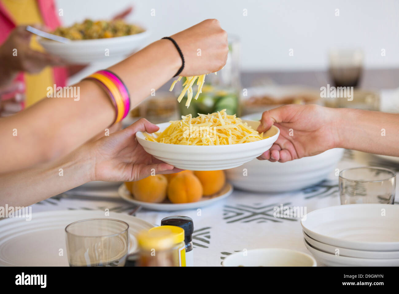 Friends having lunch at a dining table Stock Photo - Alamy