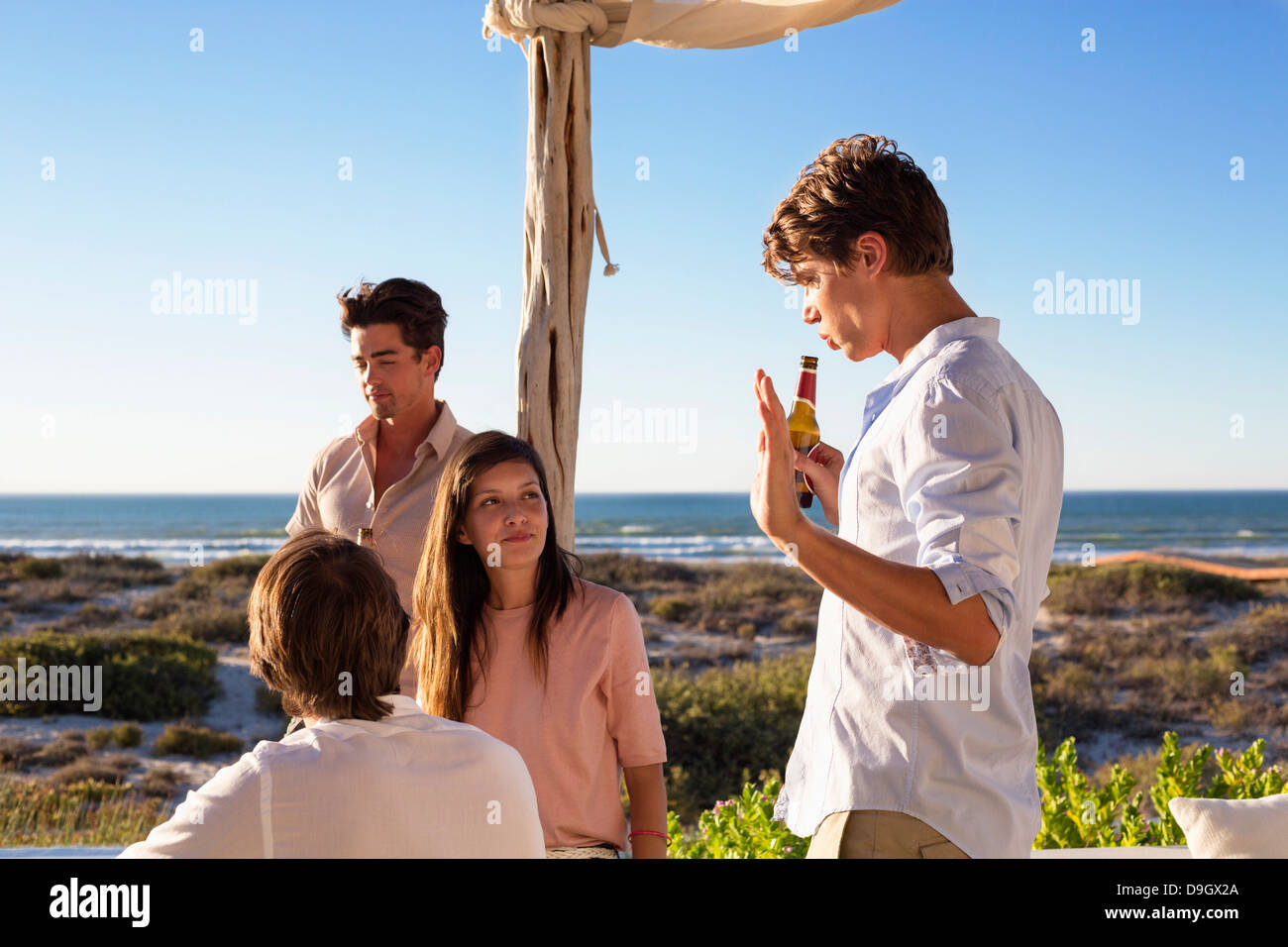 Group of friends discussing Stock Photo - Alamy