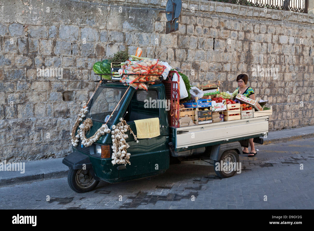 Local vegetable and fruit vendor in Cefalu, Sicily, Italy Stock Photo ...
