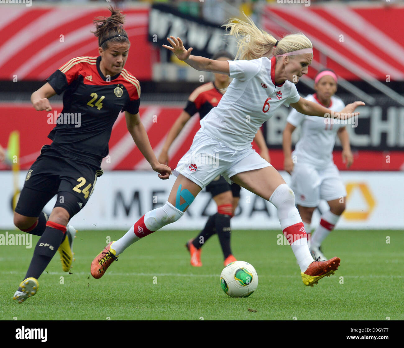 Germany's Lena Lotzen (L) vies for the ball with Canada's Kaylyn Kyle ...