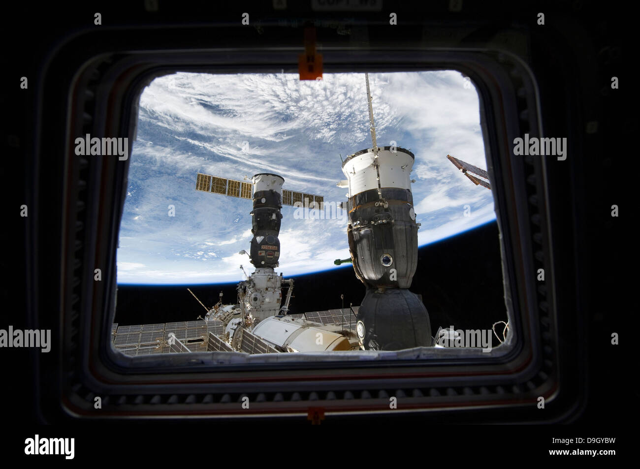 Two Russian spacecraft docked with the International Space Station, as seen from Space Shuttle ...