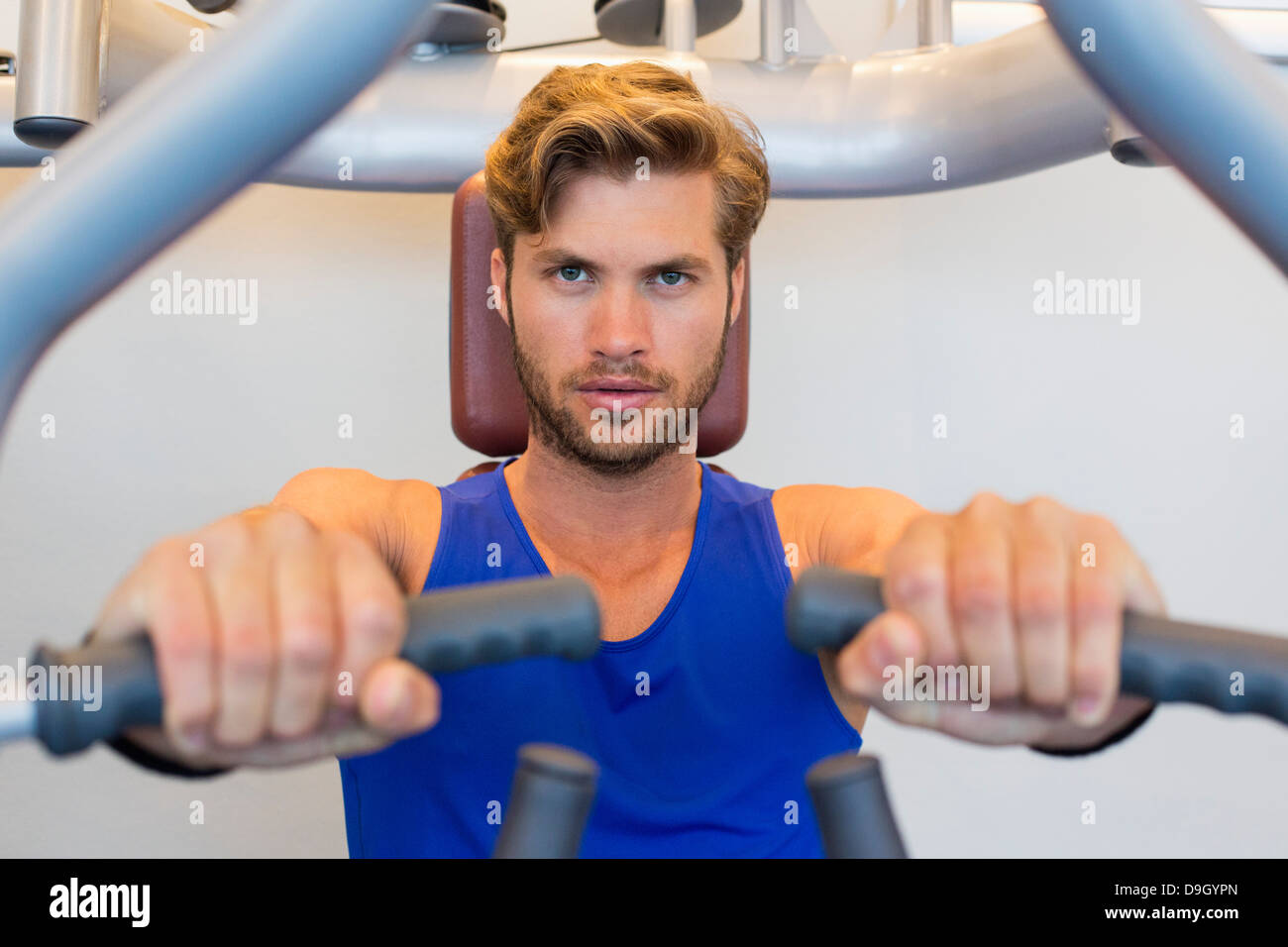 Portrait of a man exercising in a gym Stock Photo - Alamy