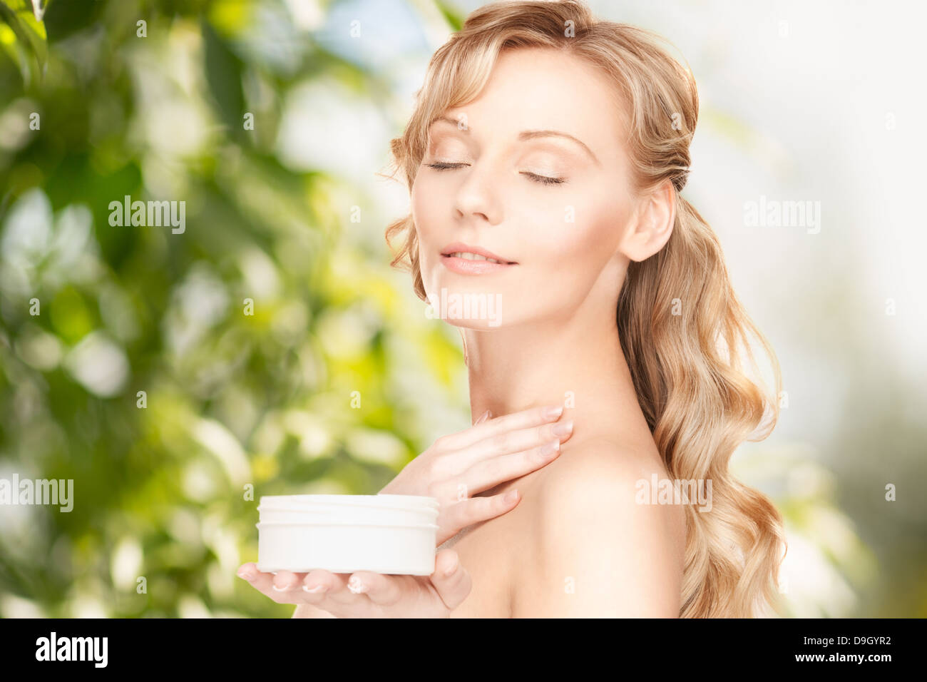 beautiful woman with moisturizing creme Stock Photo - Alamy