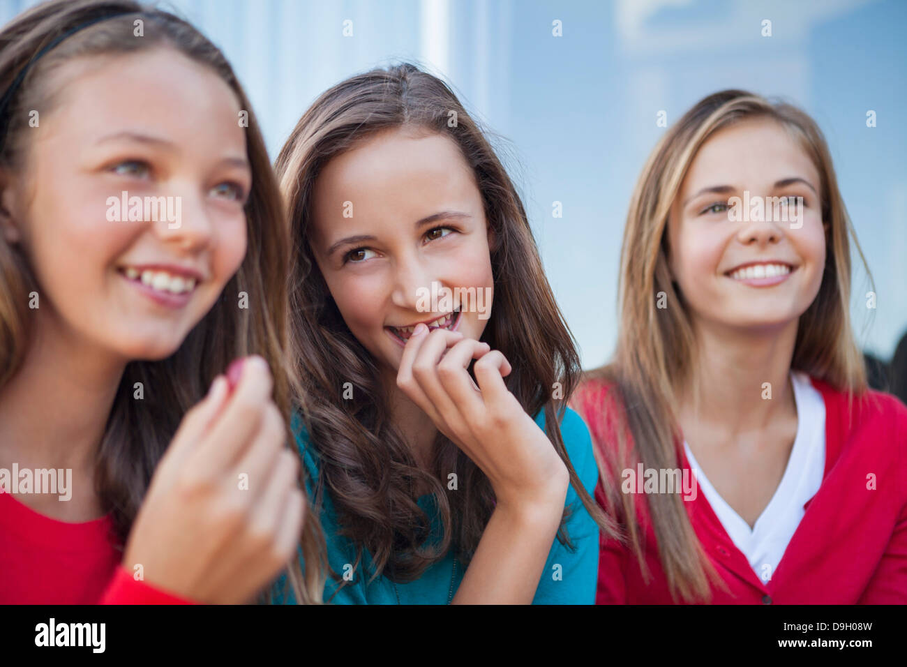 Close-up of three girls eating grapes Stock Photo - Alamy