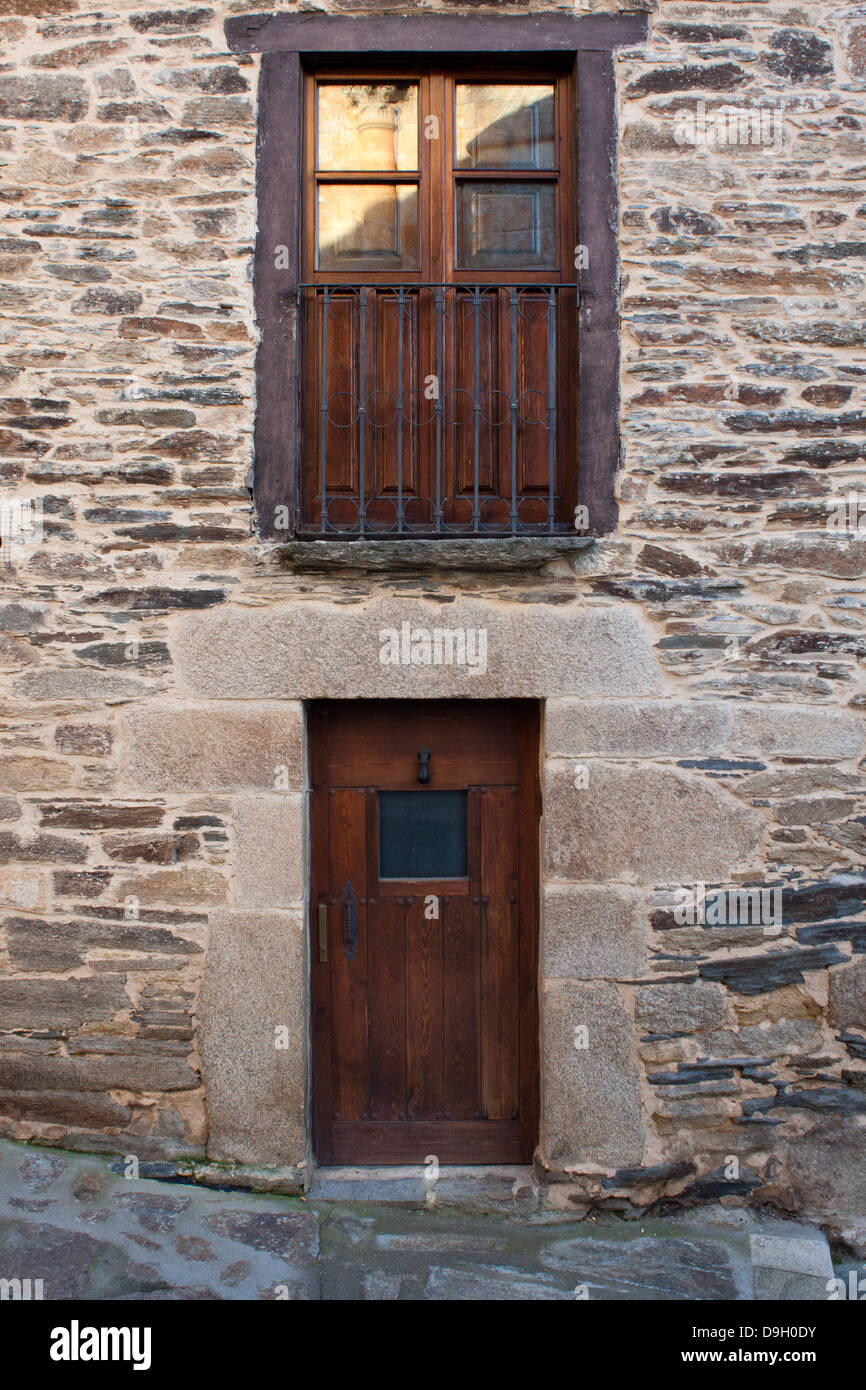Wood door and windows in ancient spanish stone house Stock Photo - Alamy