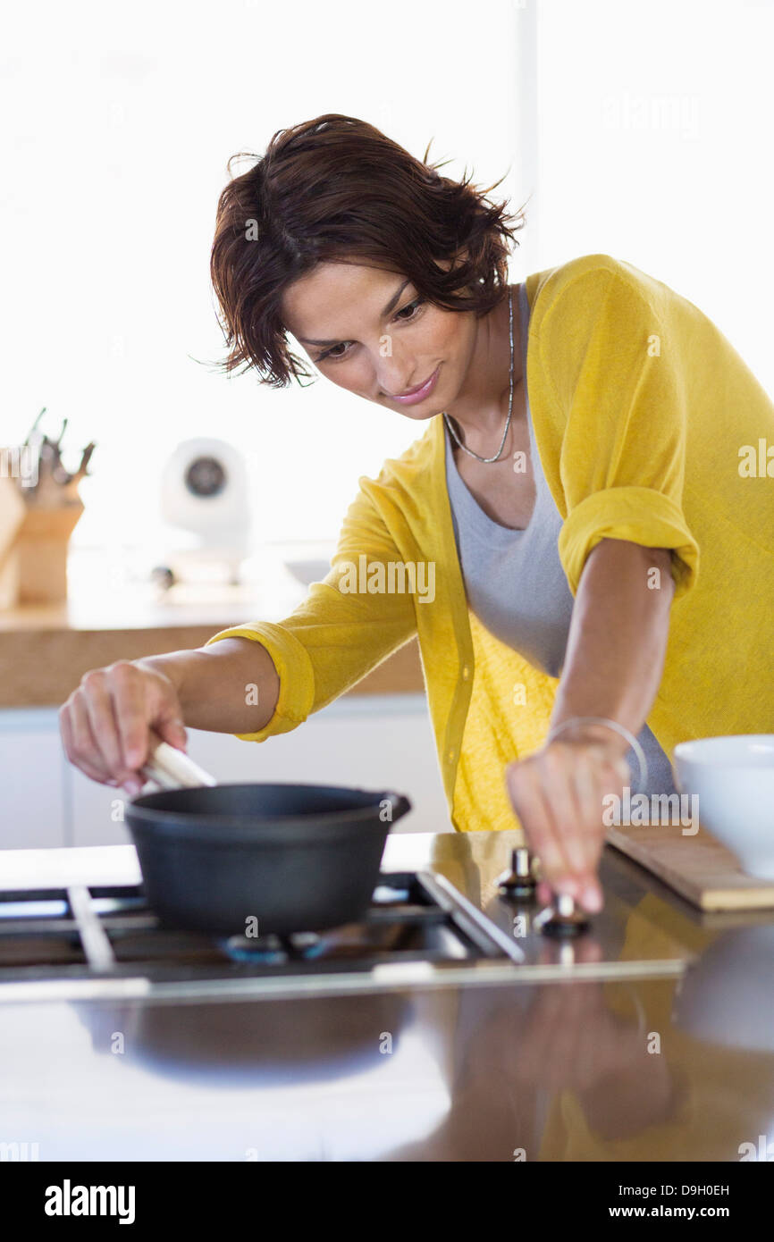 Woman cooking in the kitchen Stock Photo - Alamy