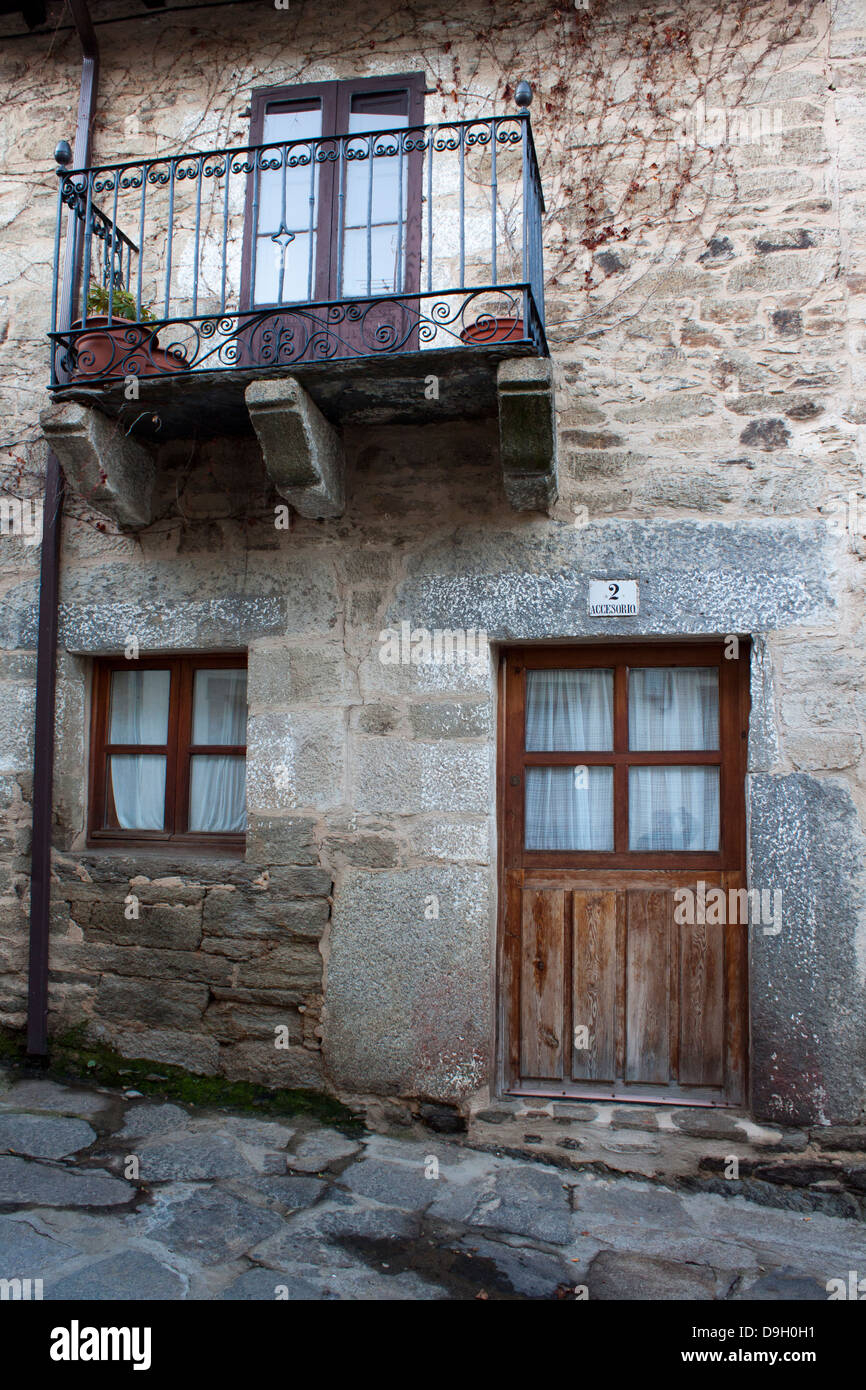 Wood door and windows in ancient spanish stone house Stock Photo - Alamy