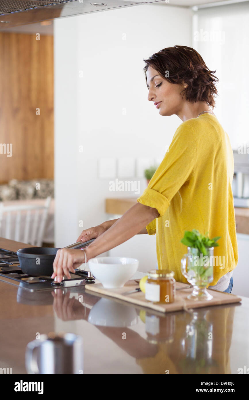 Woman cooking in the kitchen Stock Photo - Alamy