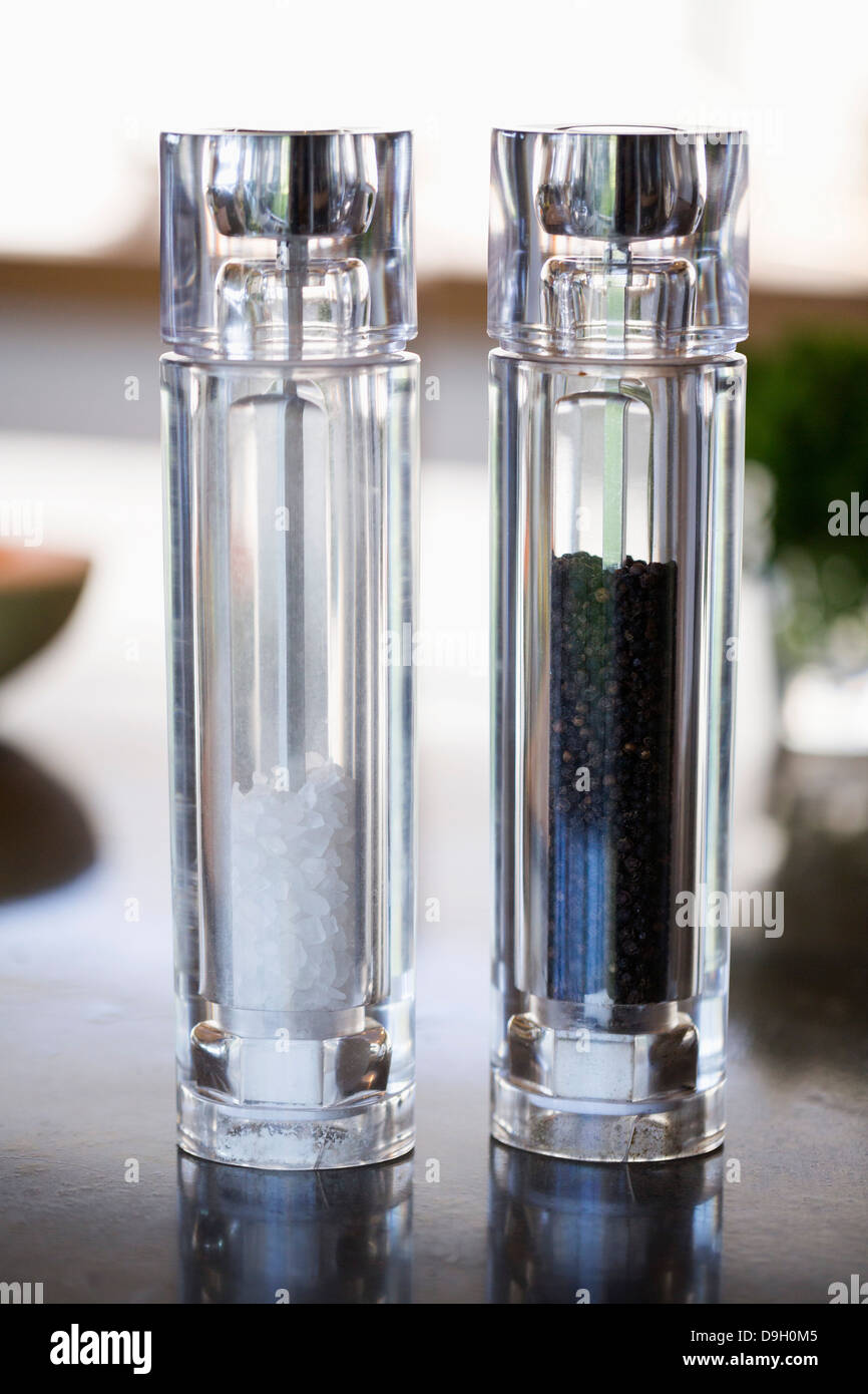 Salt shaker and pepper shaker at a kitchen counter Stock Photo - Alamy