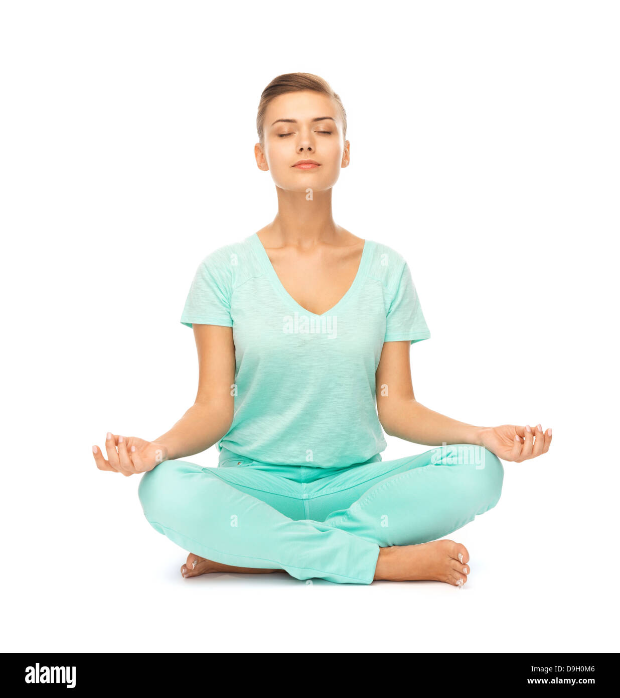 girl sitting in lotus position and meditating Stock Photo - Alamy