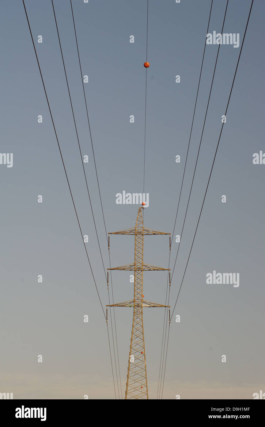 Electric pillar against blue sky Stock Photo - Alamy