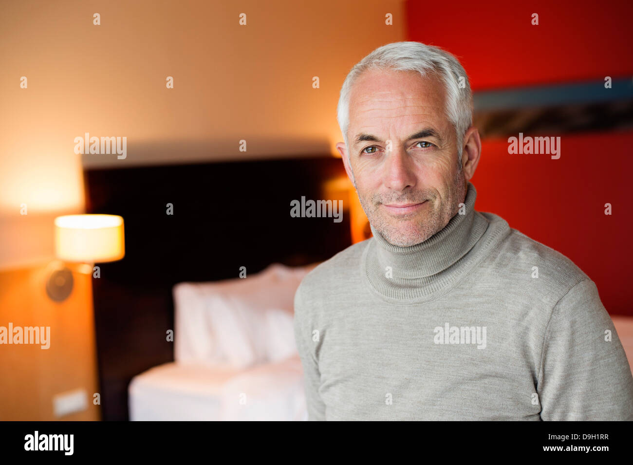 Portrait of a man in a hotel room Stock Photo - Alamy
