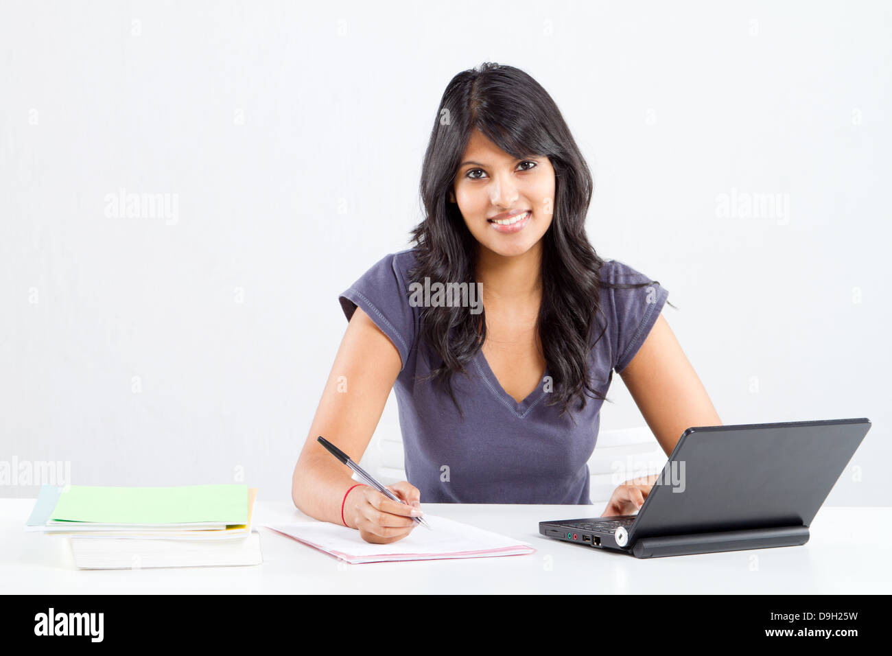 happy Indian college student studying Stock Photo - Alamy