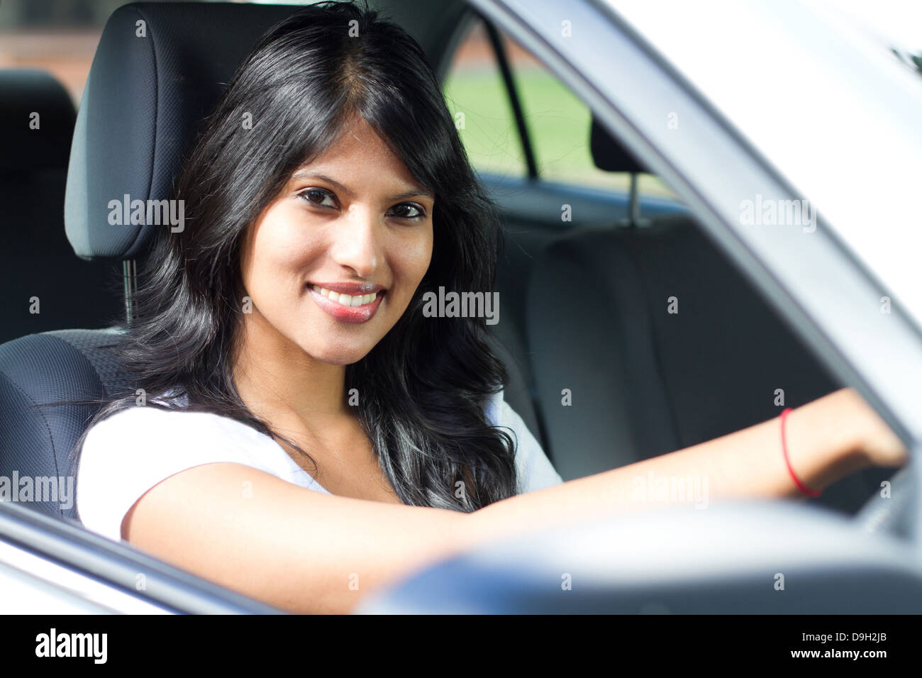 Indian young woman driving a car hi-res stock photography and images ...