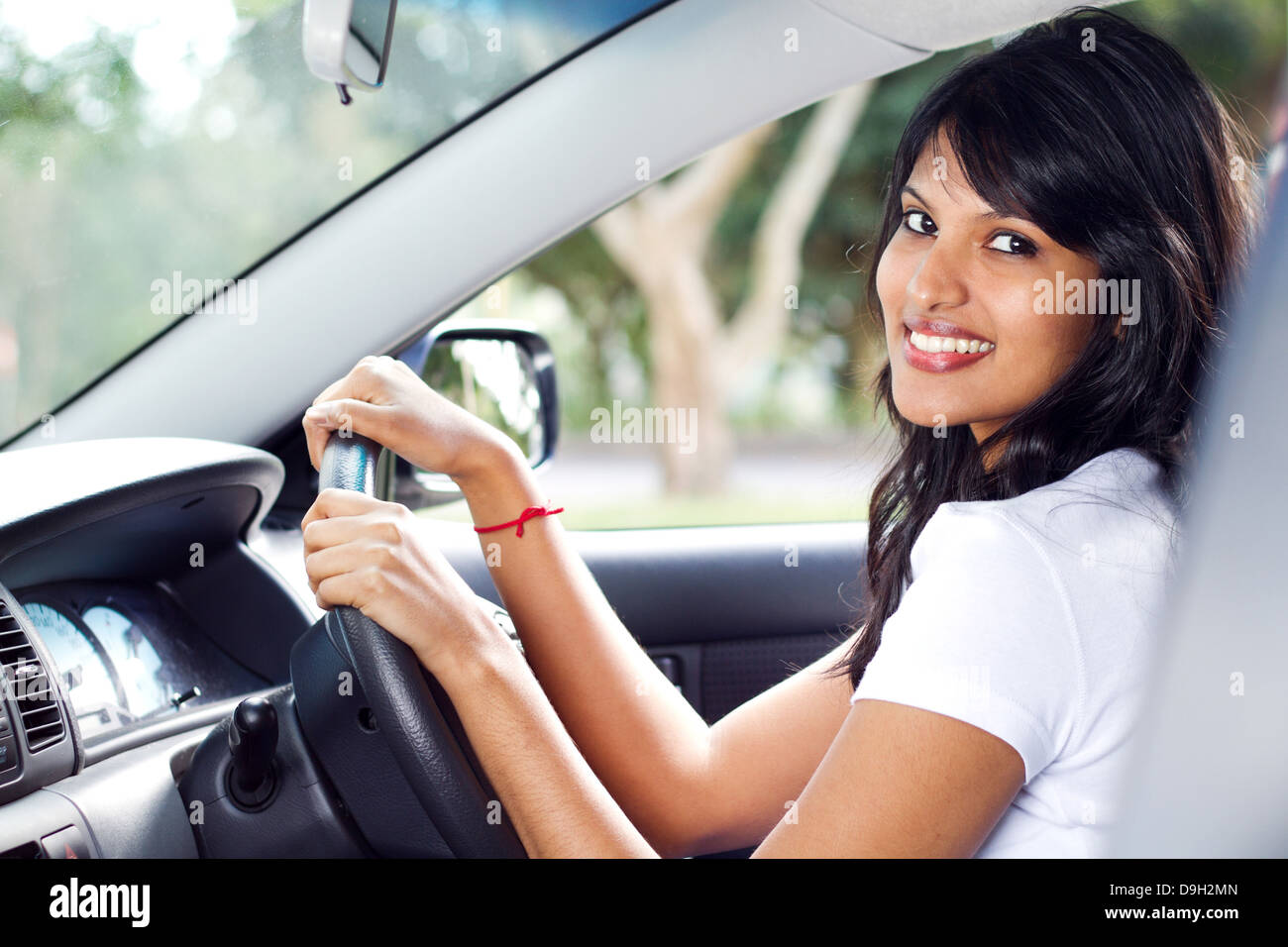 young Indian woman driving a car Stock Photo - Alamy
