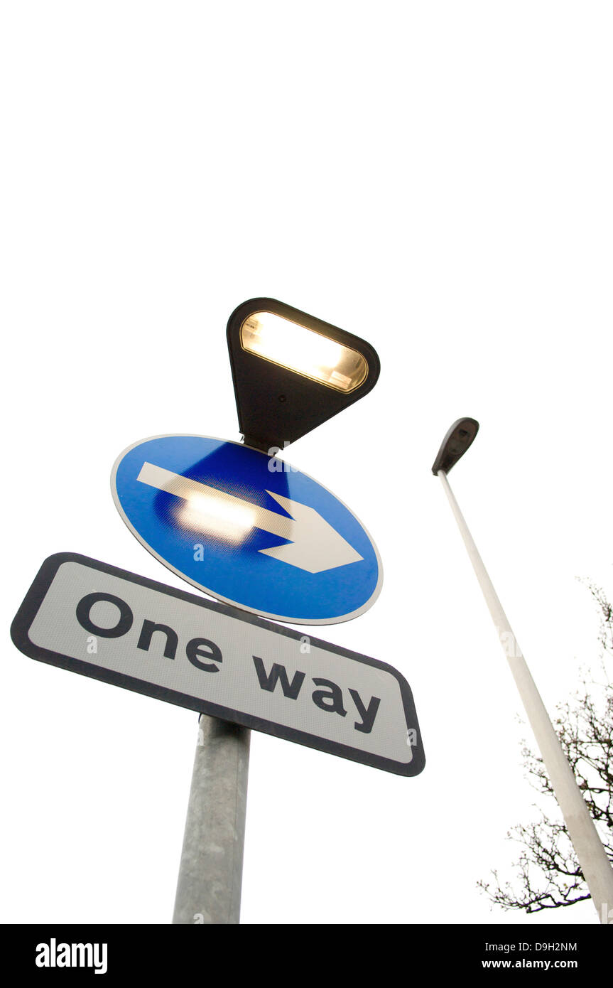 One way road traffic sign against sky Stock Photo - Alamy