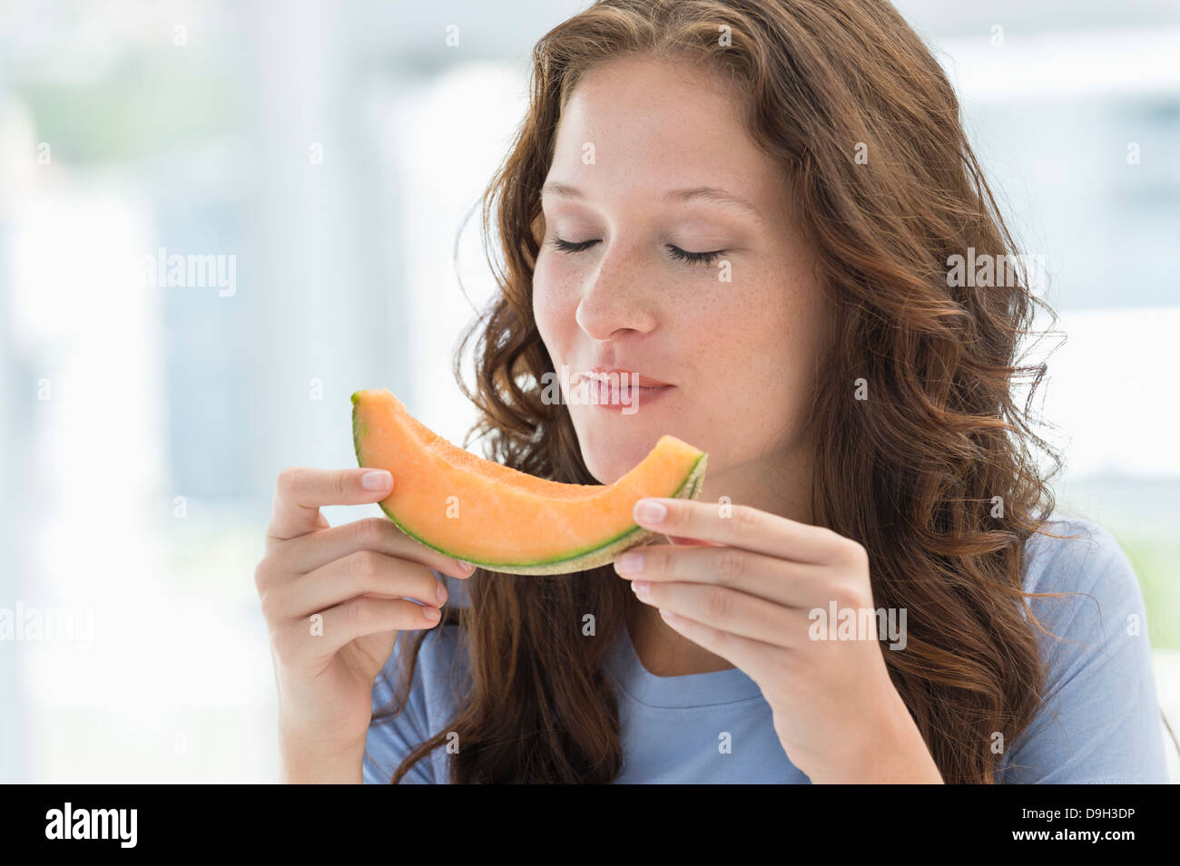 Woman eating melon hi-res stock photography and images - Alamy