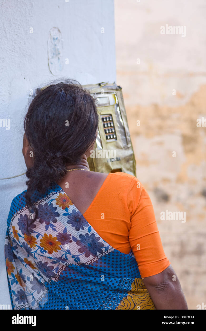 Asia, India, Karnataka, Mysore, Indian woman phoning with a public ...