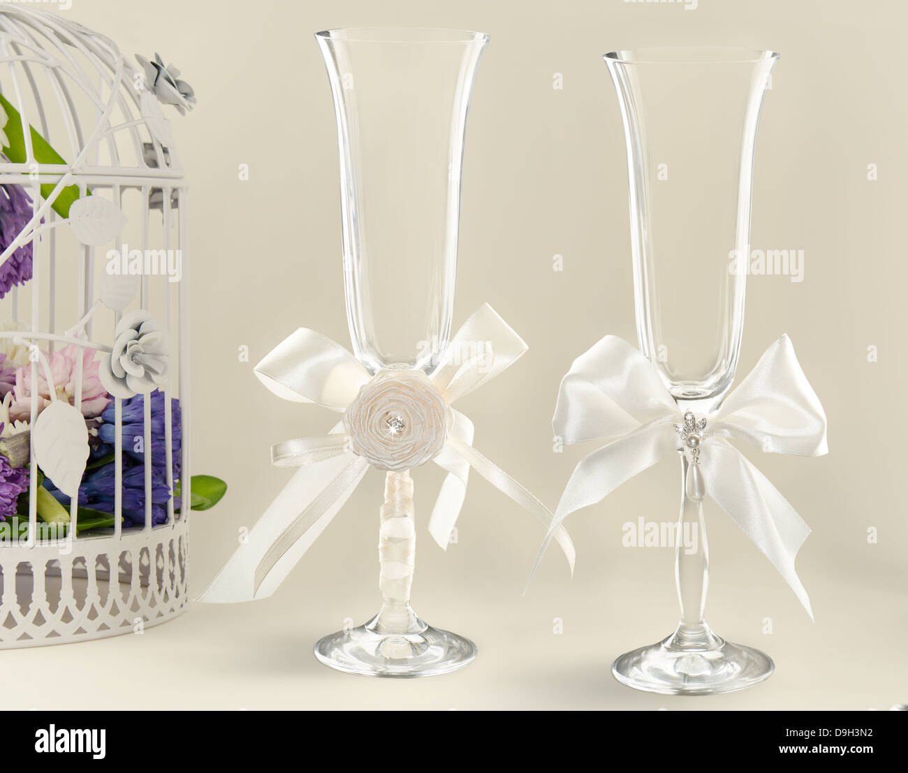 Two fancy wedding goblets glasses on tender background Stock Photo - Alamy