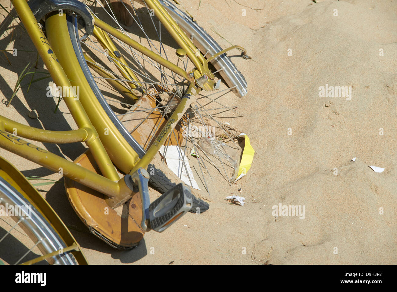 abandoned wheel bike under sand on the beach Stock Photo - Alamy