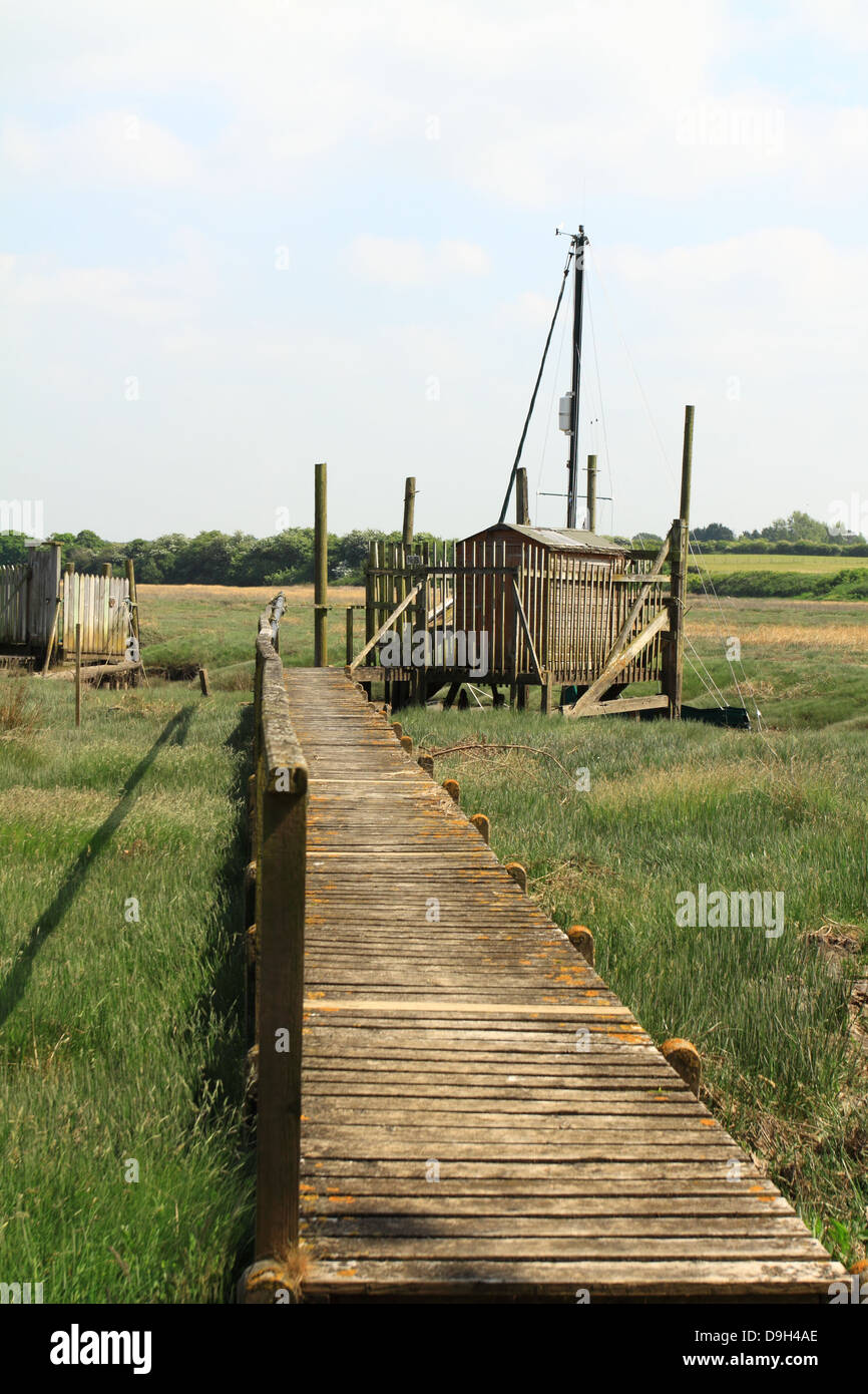 Old wooden jetty huts low hi-res stock photography and images - Alamy
