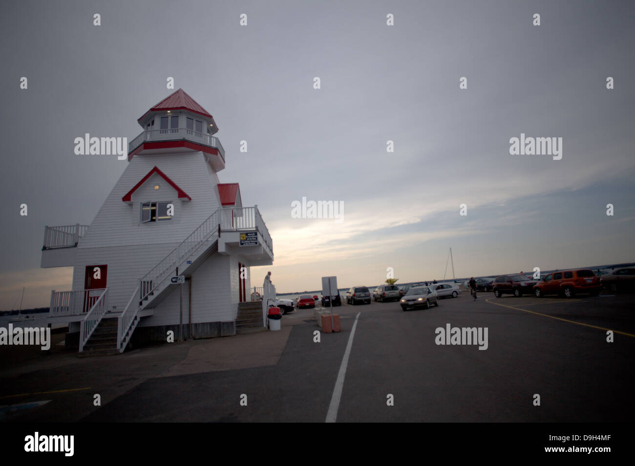The lighthouse located at the end of the Pointe-du-Chêne Wharf located ...