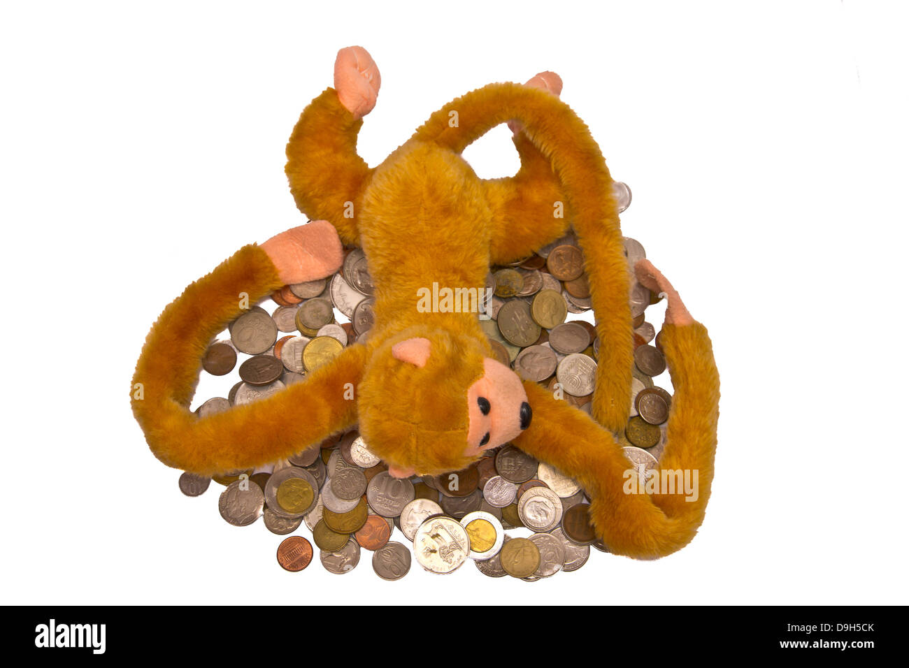 Pile of coins and a monkey isolated on white background Stock Photo - Alamy