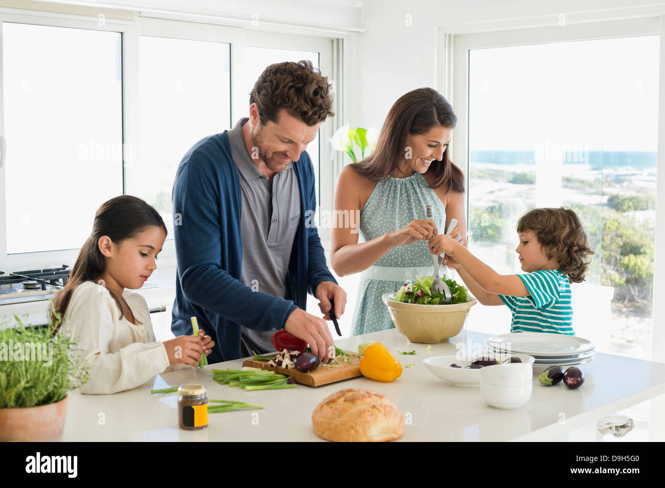 Family preparing food Stock Photo - Alamy