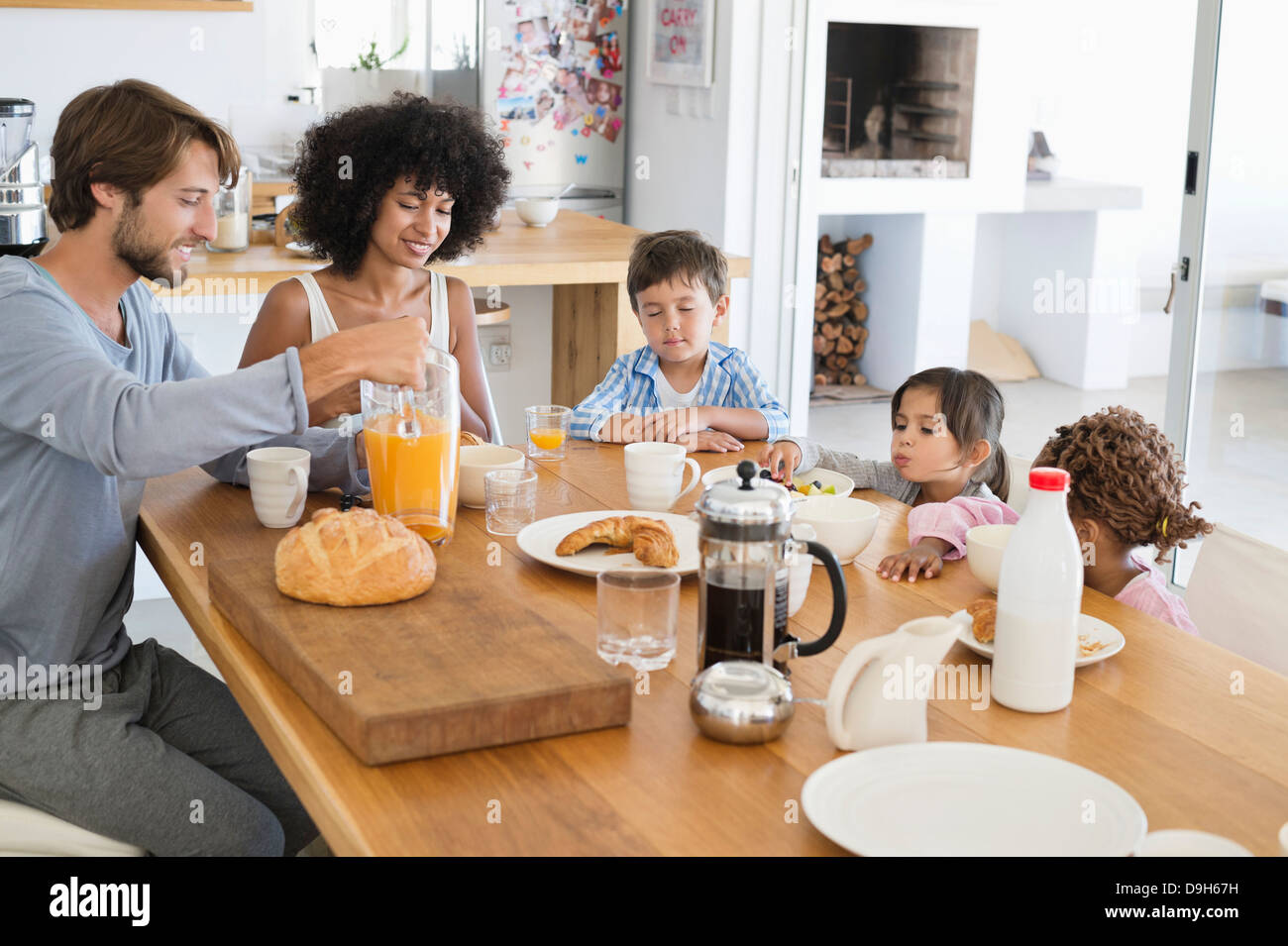 Family at breakfast table Stock Photo - Alamy
