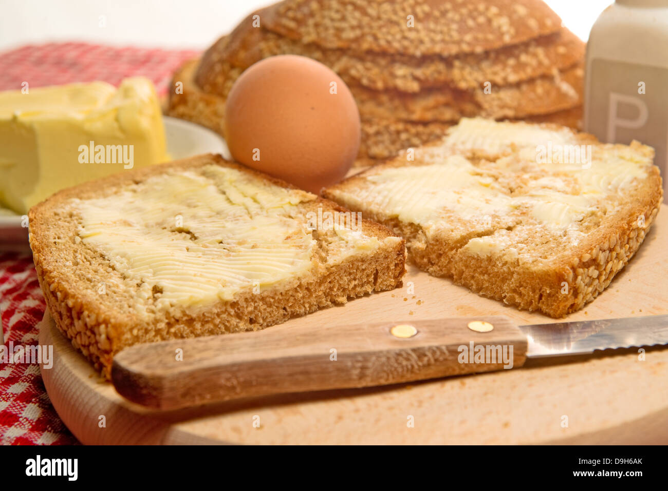 Bread and butter on a table, served for breakfast Stock Photo - Alamy