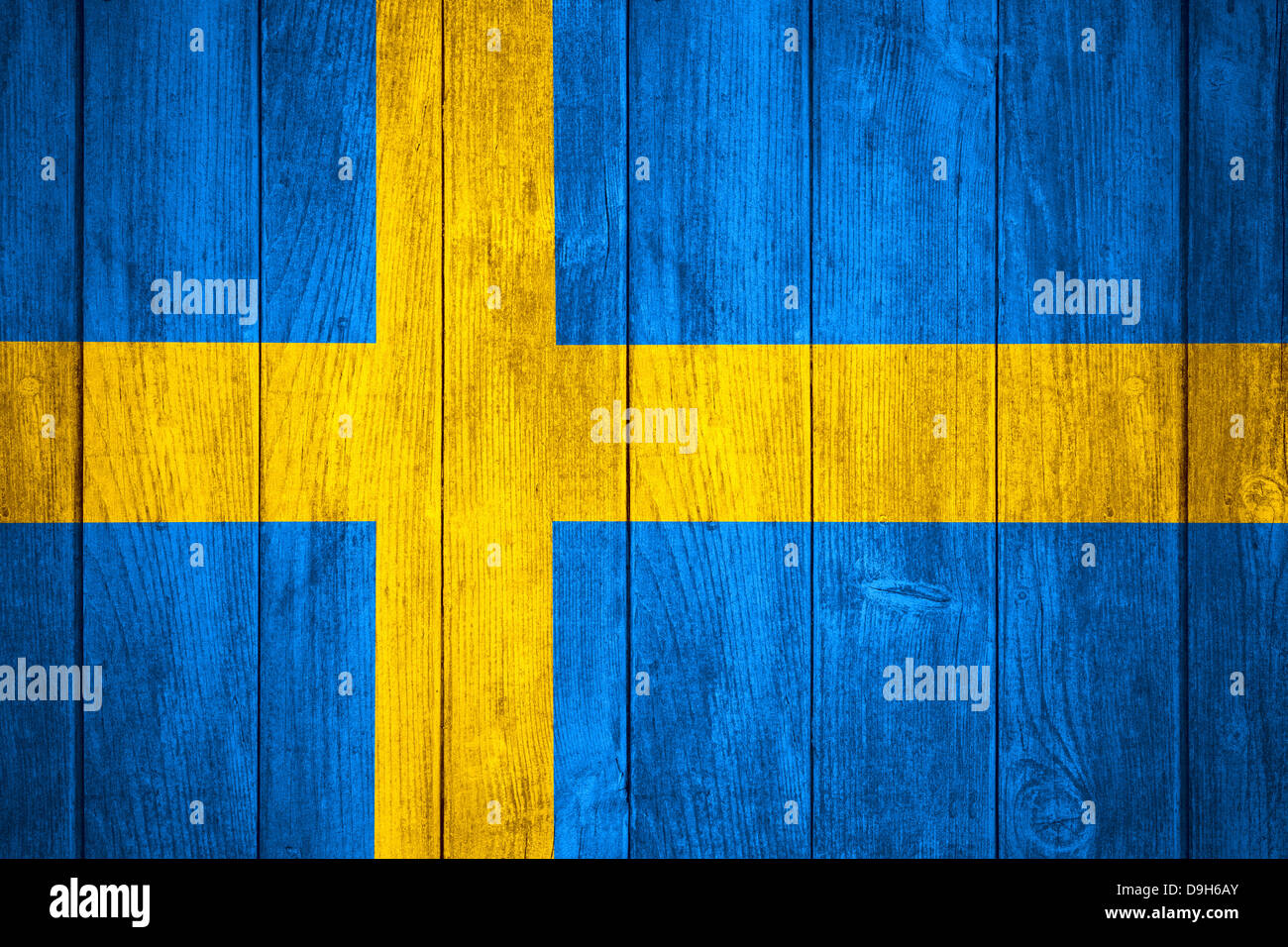 Sweden flag or blue and yellow Swedish banner on wooden background ...