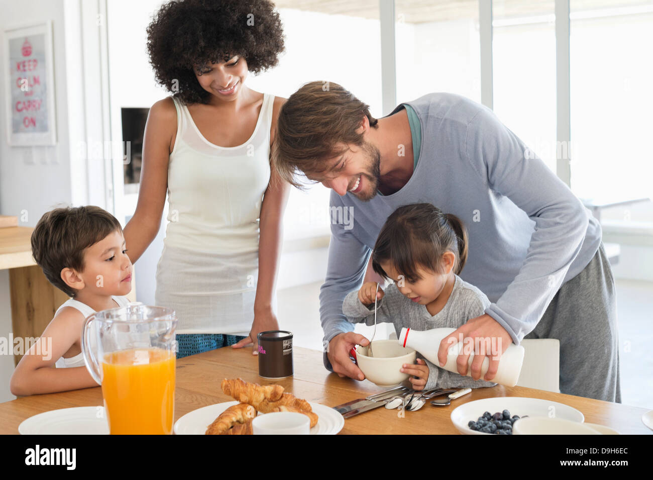 Family having breakfast at a dining table Stock Photo - Alamy