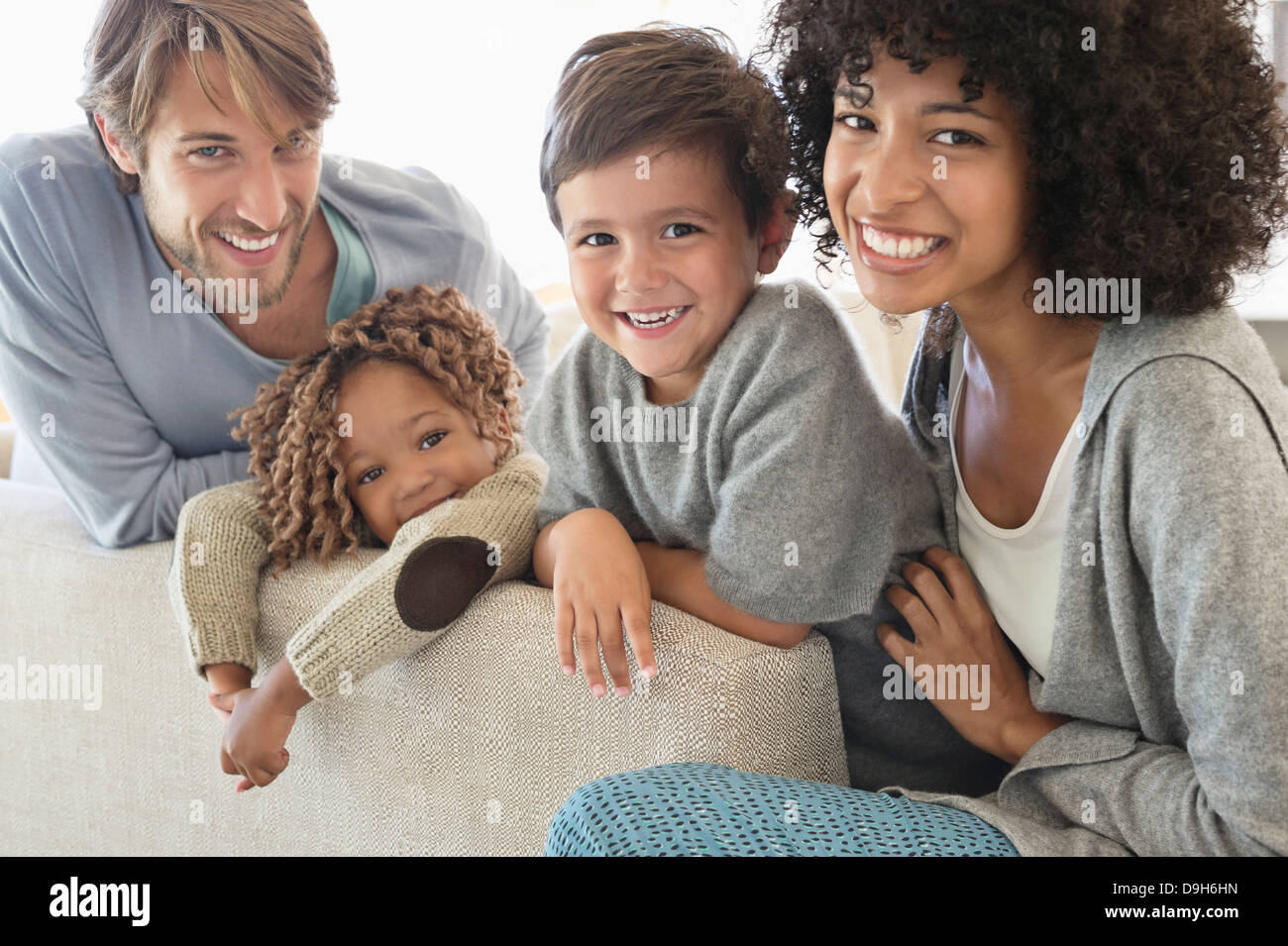 Portrait of a couple smiling with their children Stock Photo - Alamy