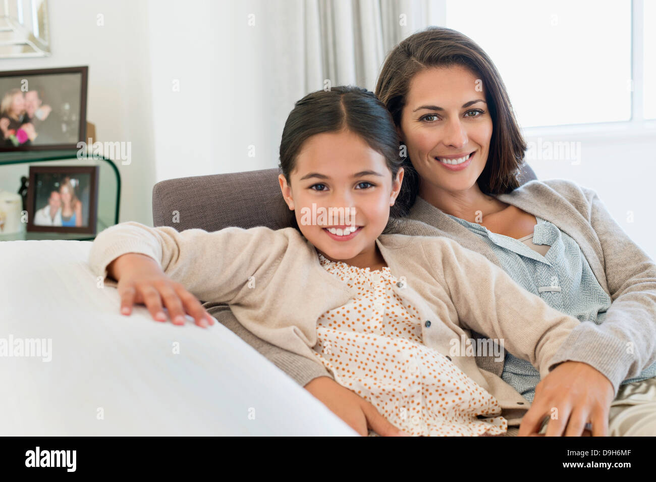 Portrait of a woman and her daughter smiling Stock Photo - Alamy