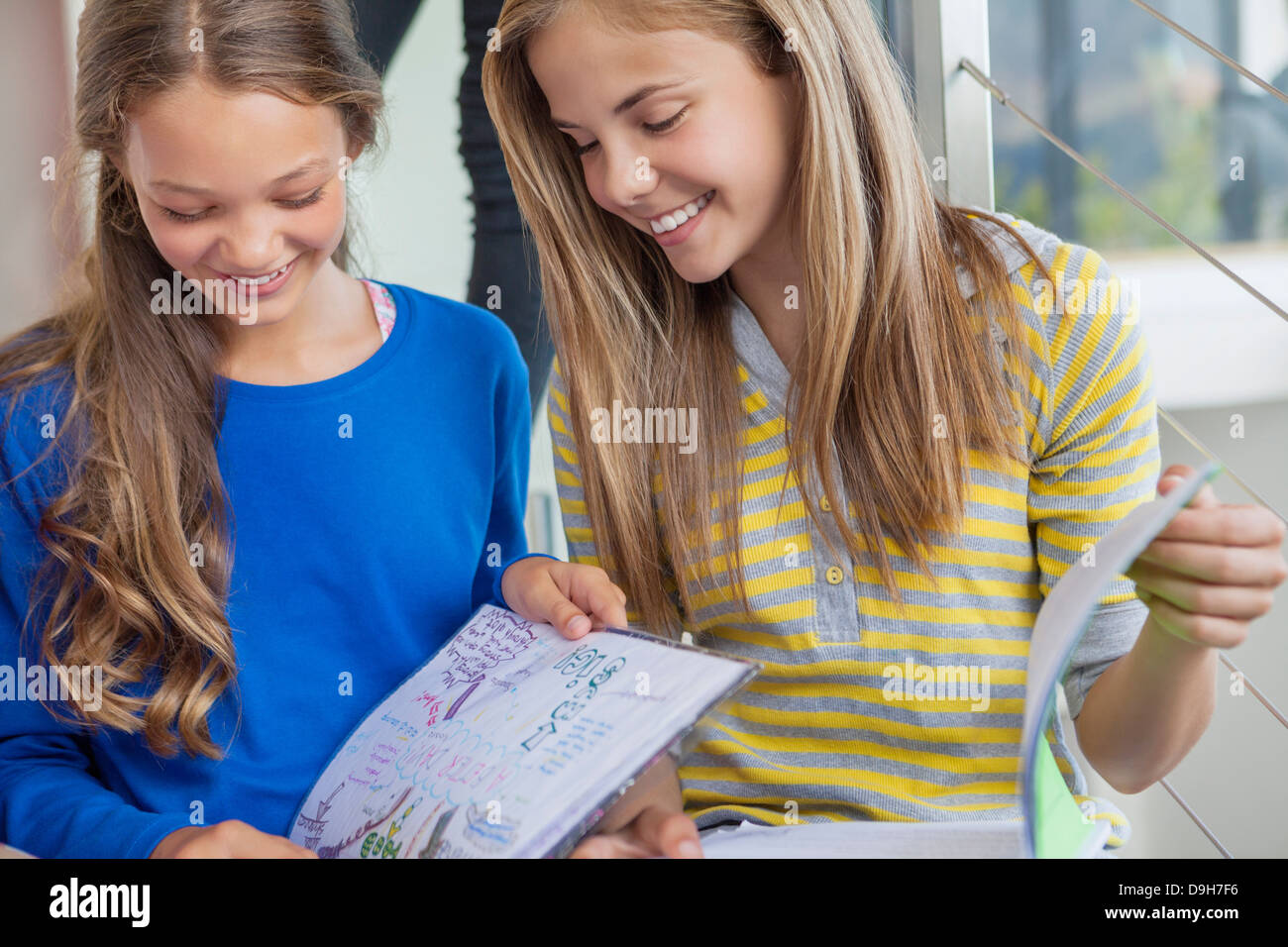 Two girls studying in a school Stock Photo - Alamy
