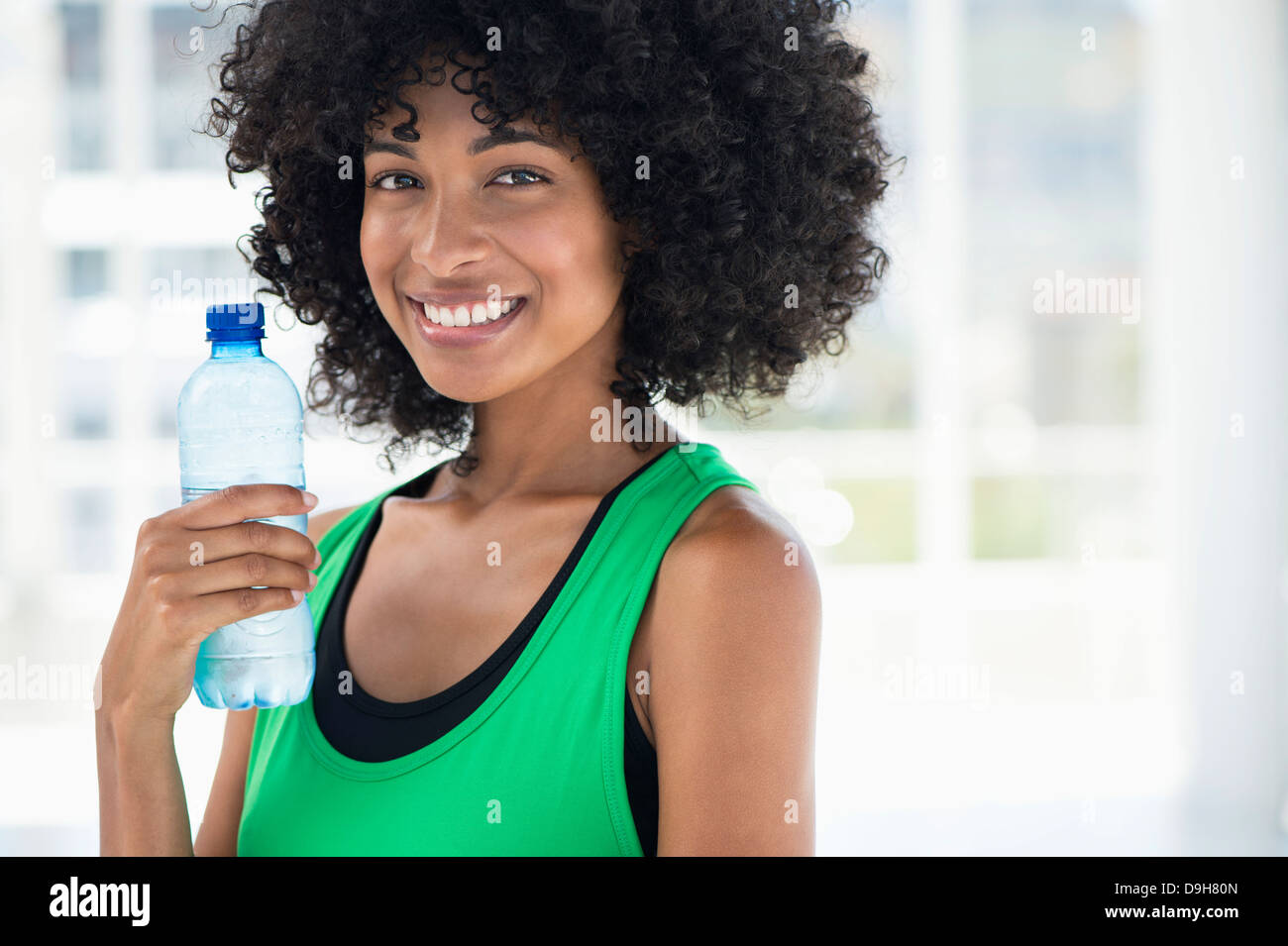 Young woman drinking water smile hi-res stock photography and images ...