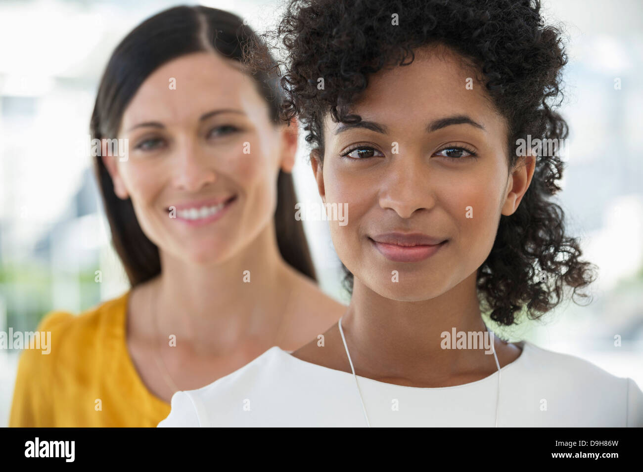 Portrait of two female friends smiling together Stock Photo - Alamy