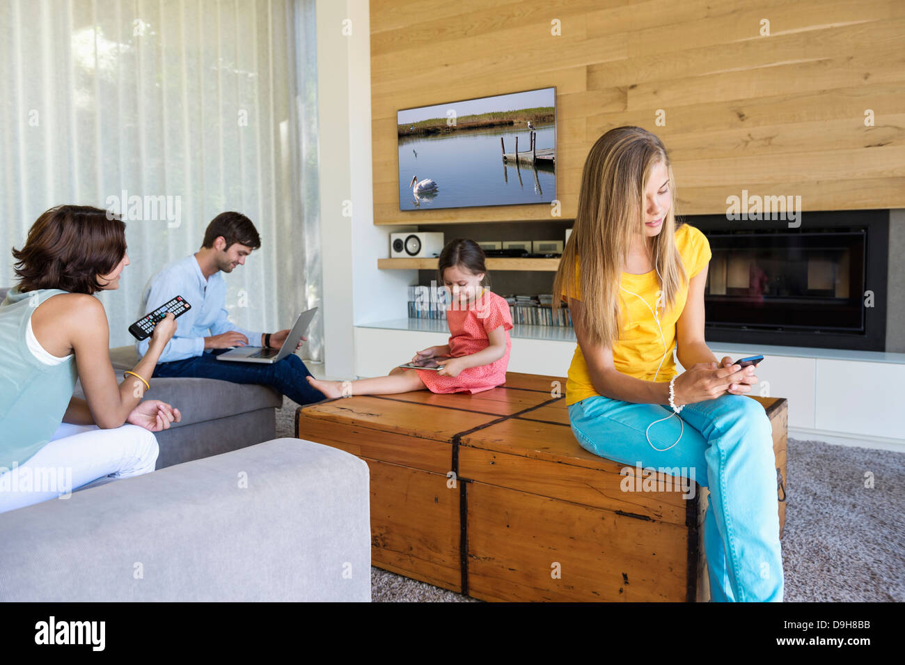 Family using electronics gadgets Stock Photo - Alamy