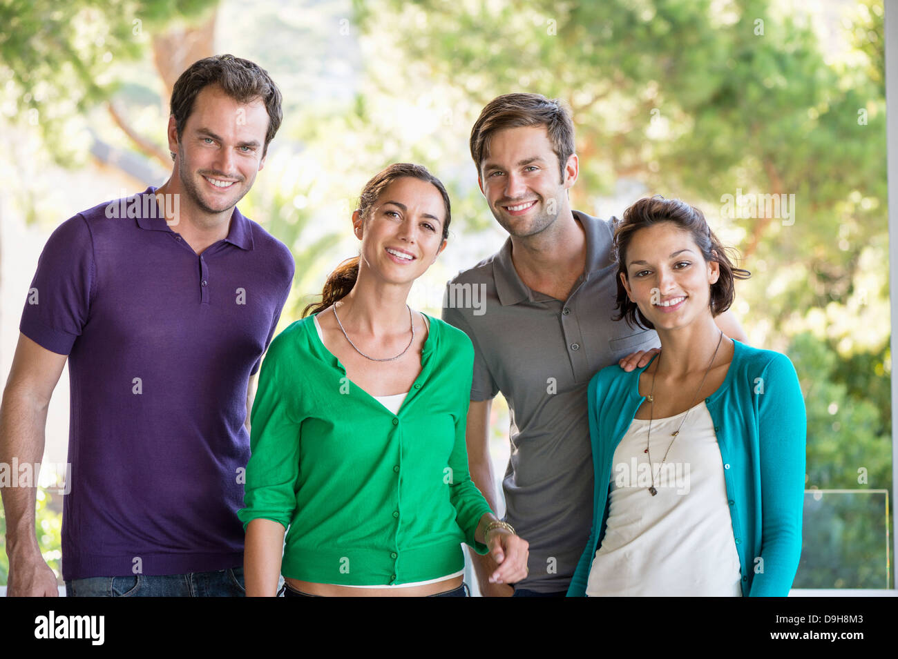 Portrait of four friends smiling Stock Photo - Alamy